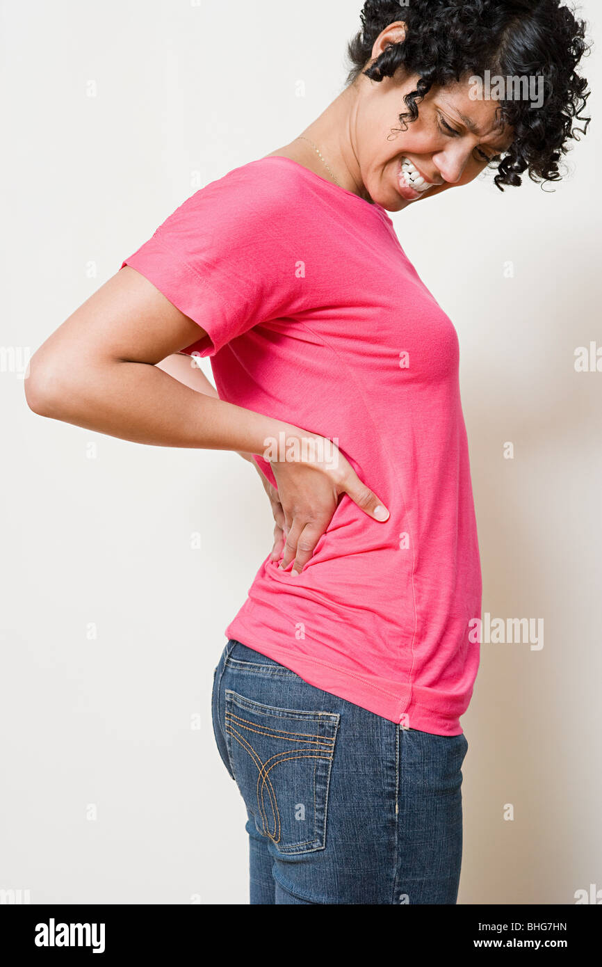 Woman with a backache Stock Photo - Alamy
