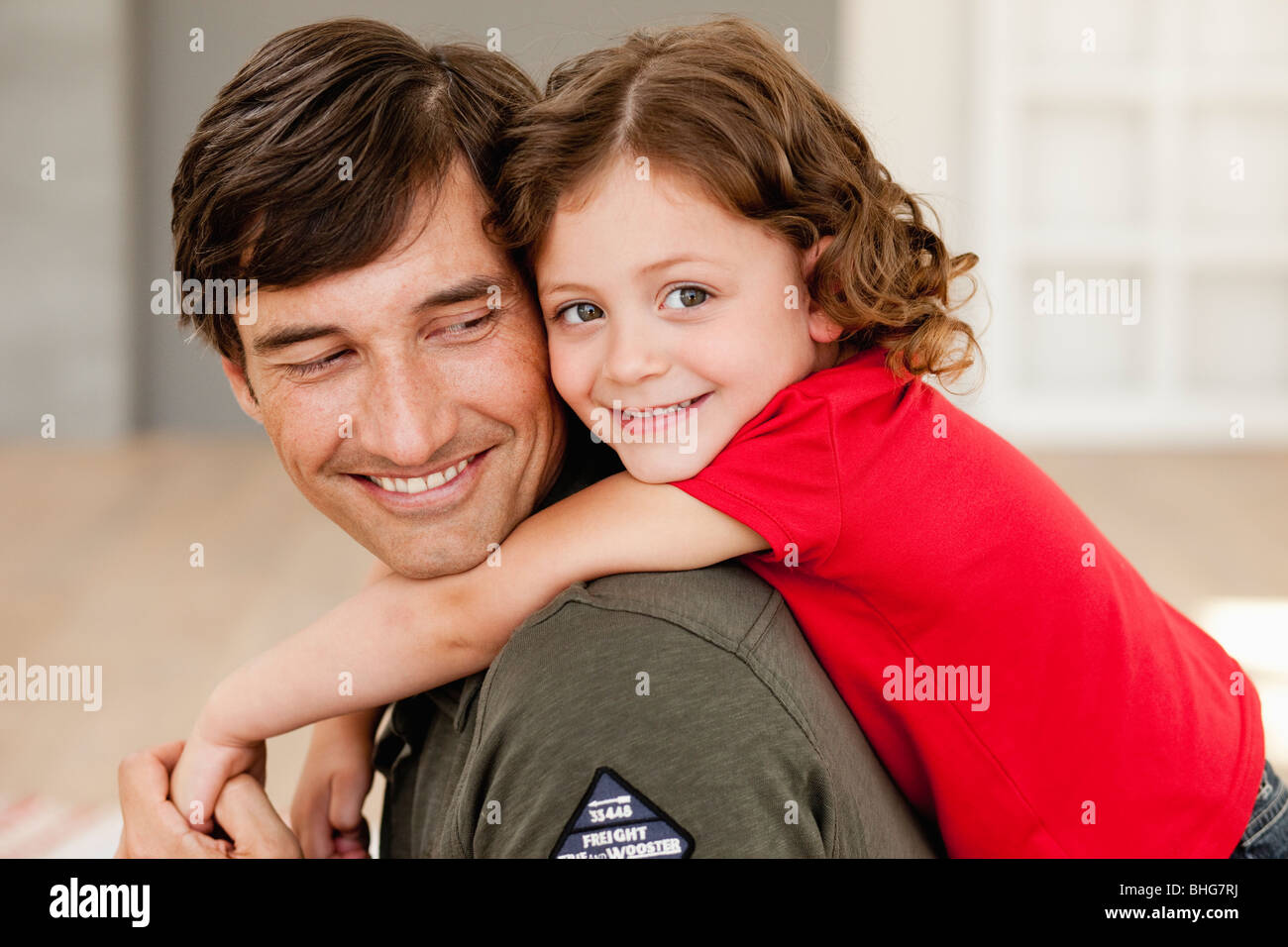 daughter riding on father's back Stock Photo - Alamy