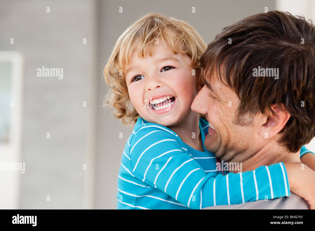 son and father hugging Stock Photo - Alamy