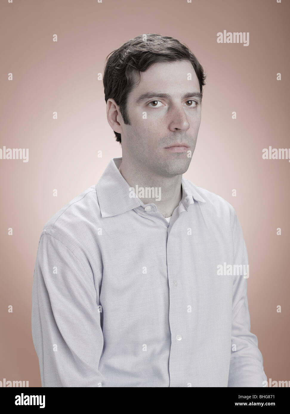 Portrait of a serious looking man Stock Photo - Alamy