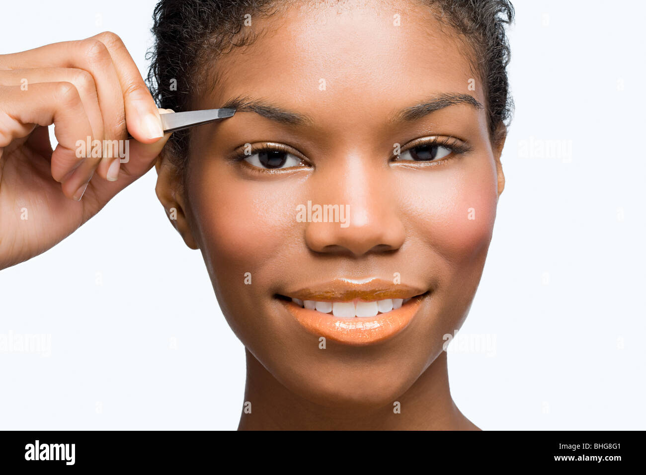 Plucking eyebrows hi-res stock photography and images - Alamy