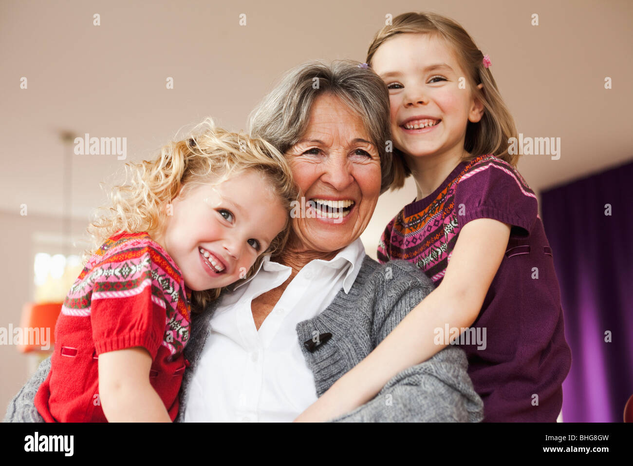 grandma and grandchildren hugging Stock Photo - Alamy