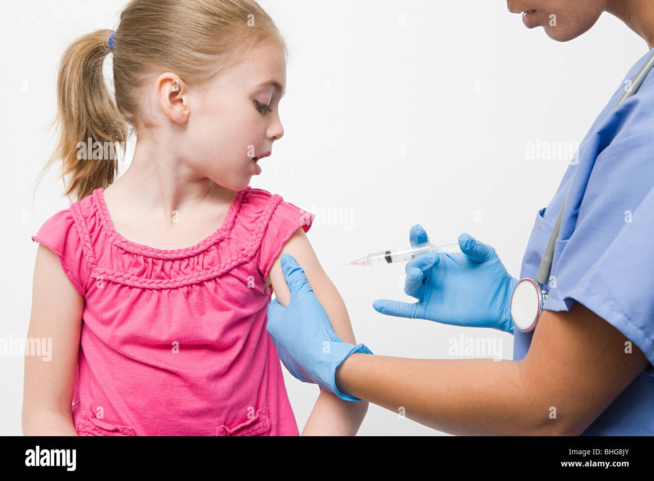 Girl getting immunization Stock Photo - Alamy