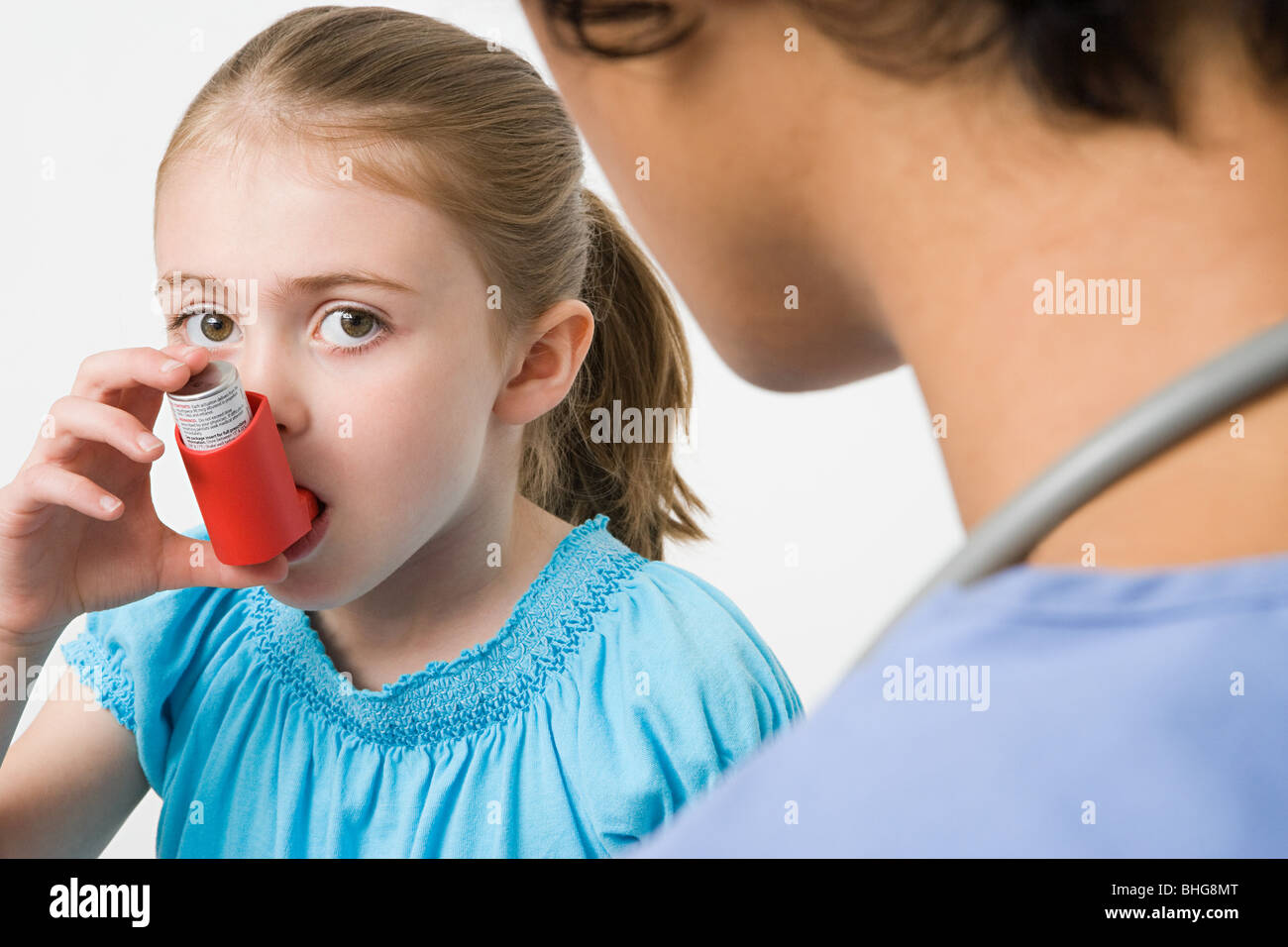 Girl taking asthma inhaler Stock Photo - Alamy