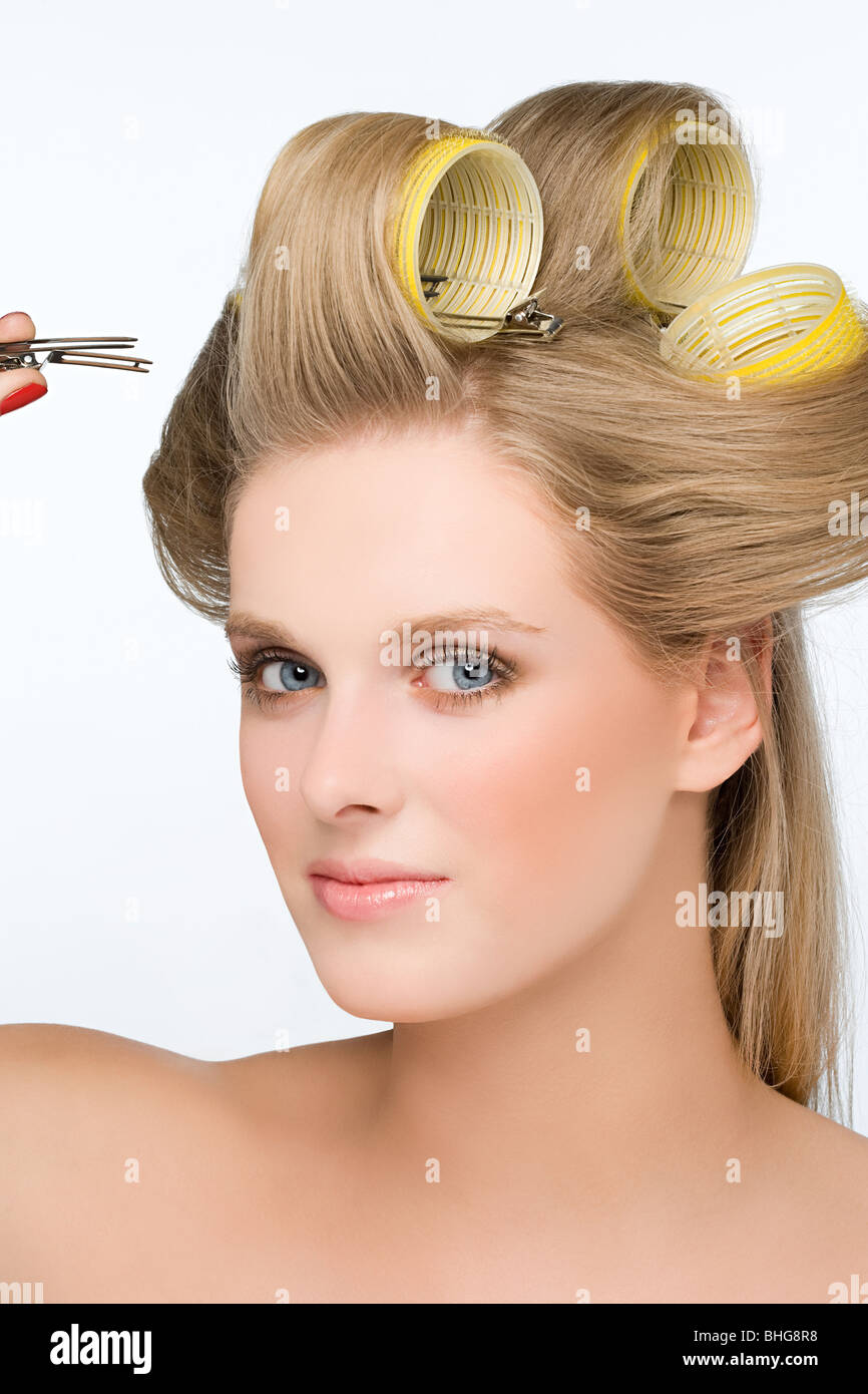Young woman with curlers in her hair Stock Photo - Alamy
