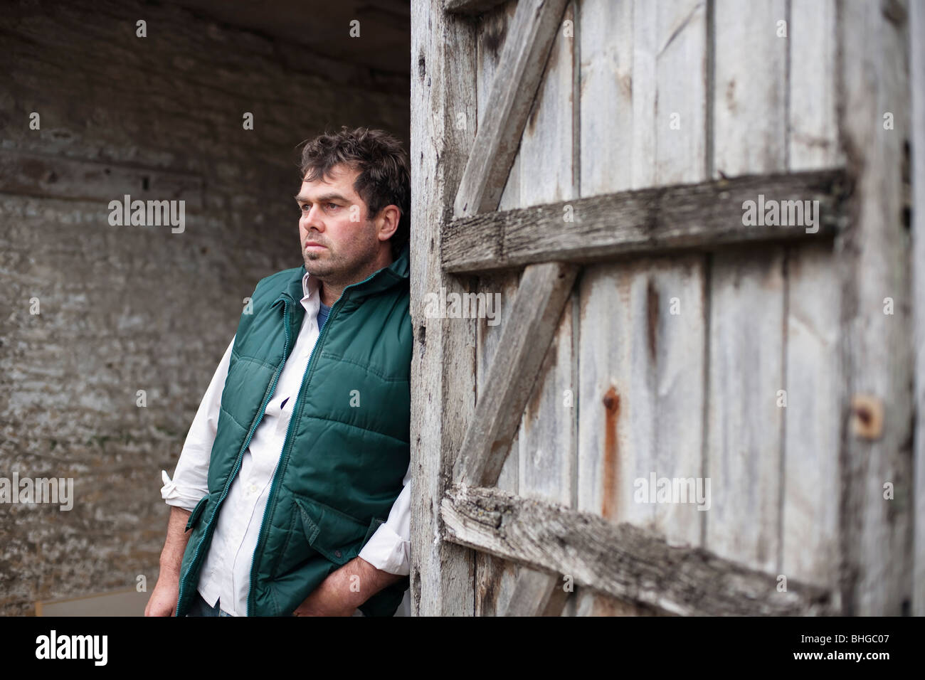 farmer standing in barn Stock Photo - Alamy