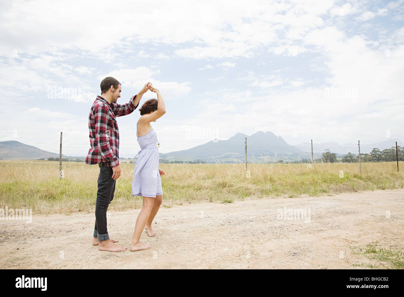 Couple dancing in remote landscape Stock Photo - Alamy