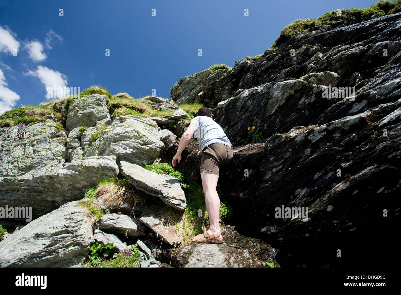 Strong male climber climbing steep hi-res stock photography and images ...