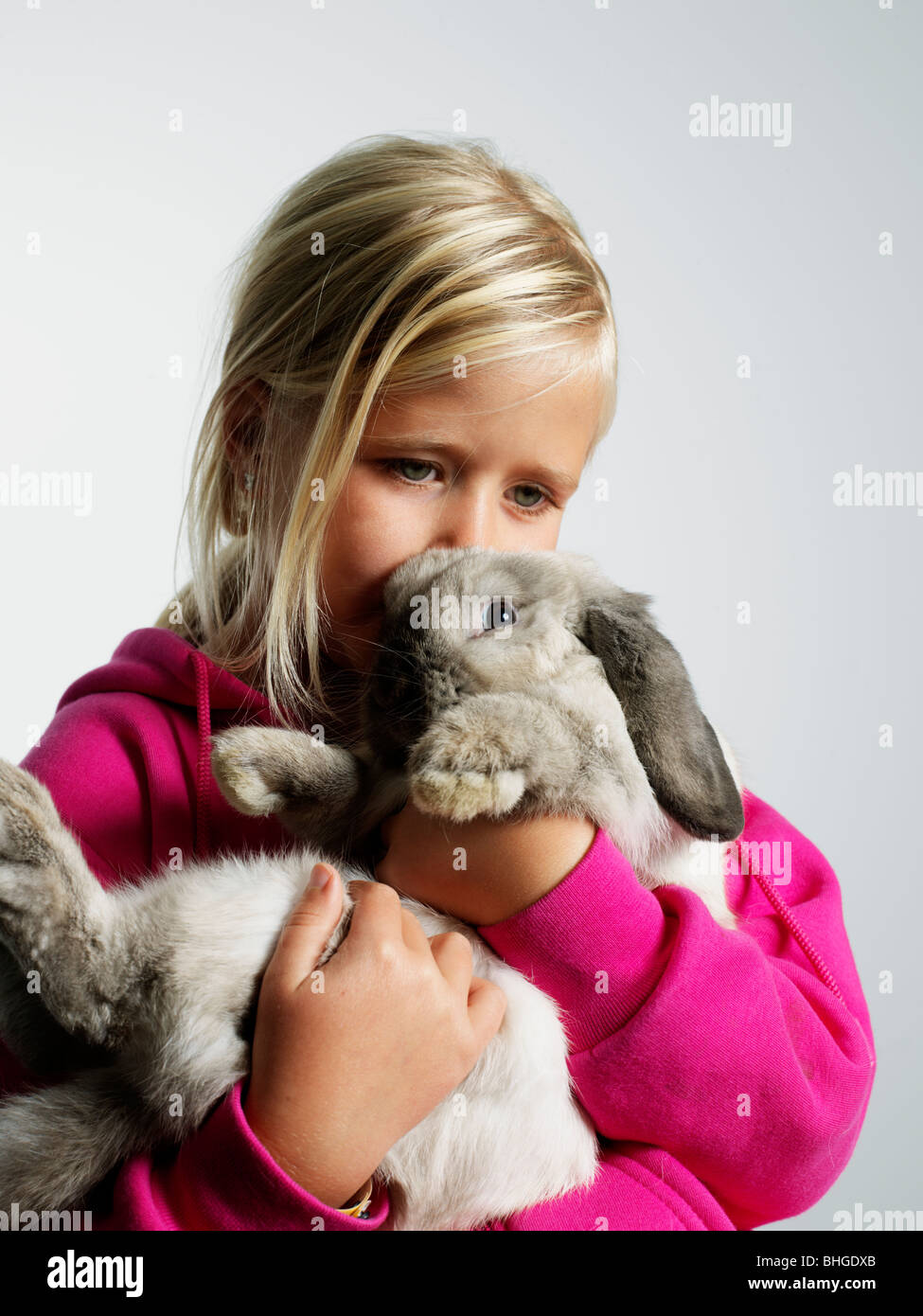 Portrait of a girl with a rabbit in her arms Stock Photo - Alamy