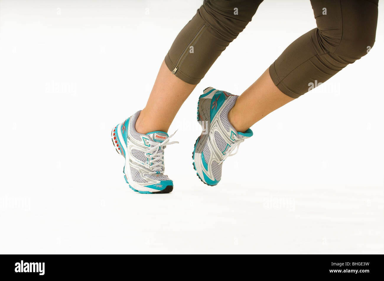 The legs of a running woman Stock Photo - Alamy