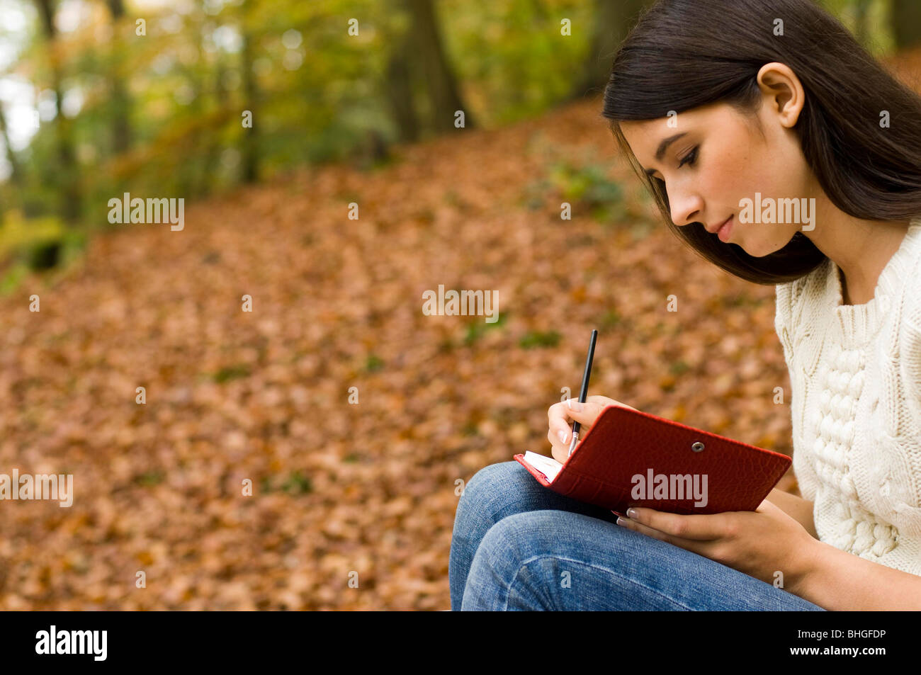 girl writing in woods Stock Photo - Alamy