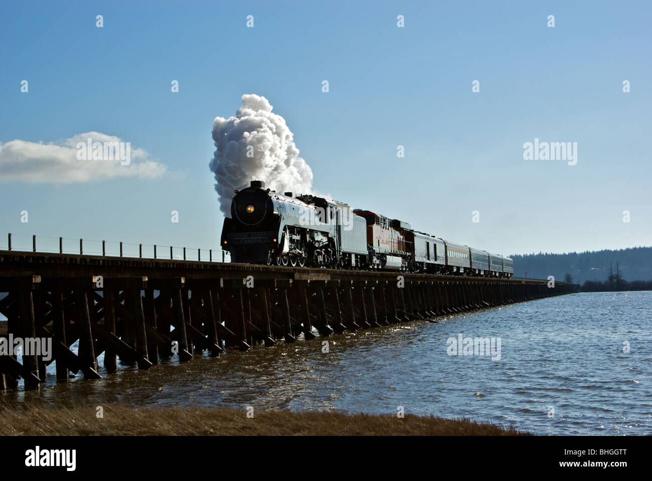 Restored CPR Royal Hudson 2860 steam engine crossing Serpentine River ...