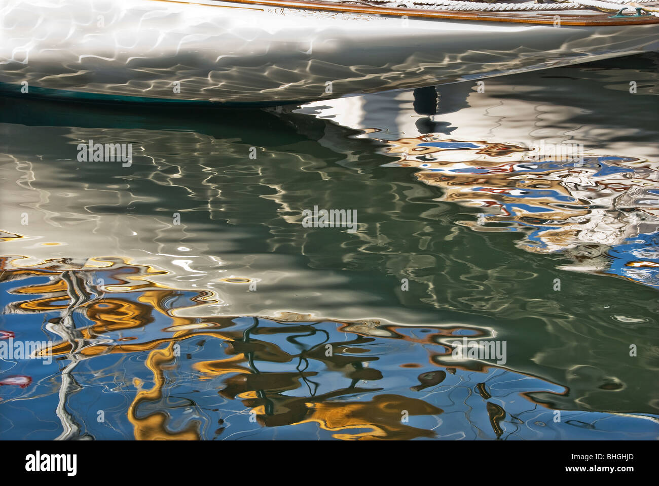 Reflections of boat in the water Stock Photo - Alamy