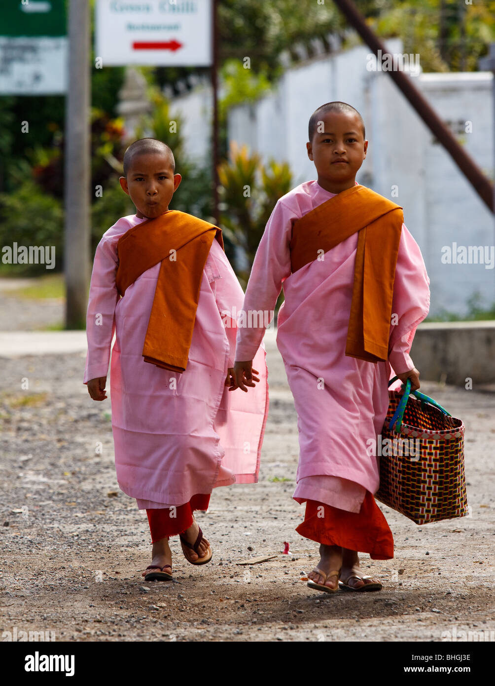 Two girl nuns walking on a road Stock Photo - Alamy