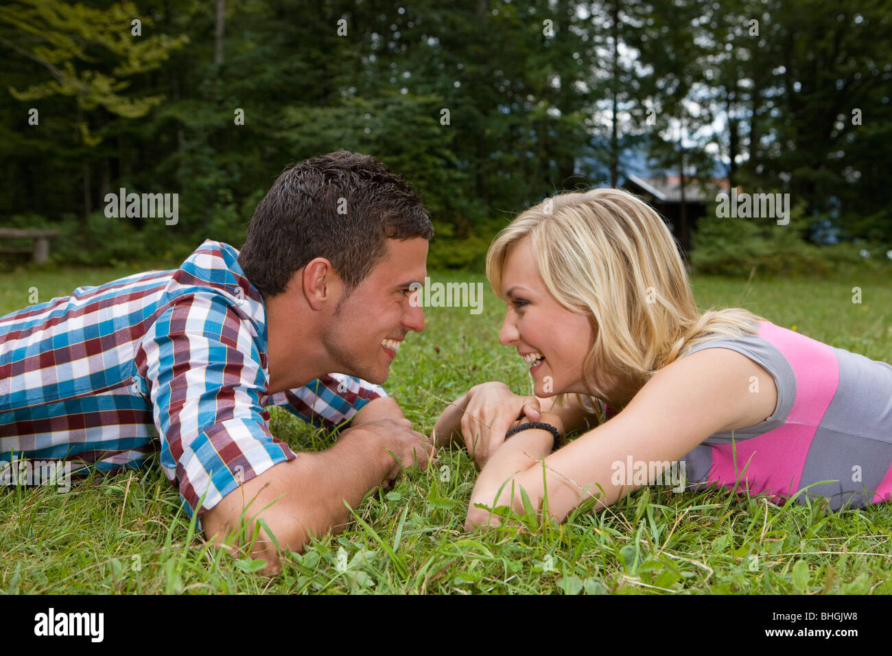 A young couple laughing at each other Stock Photo - Alamy