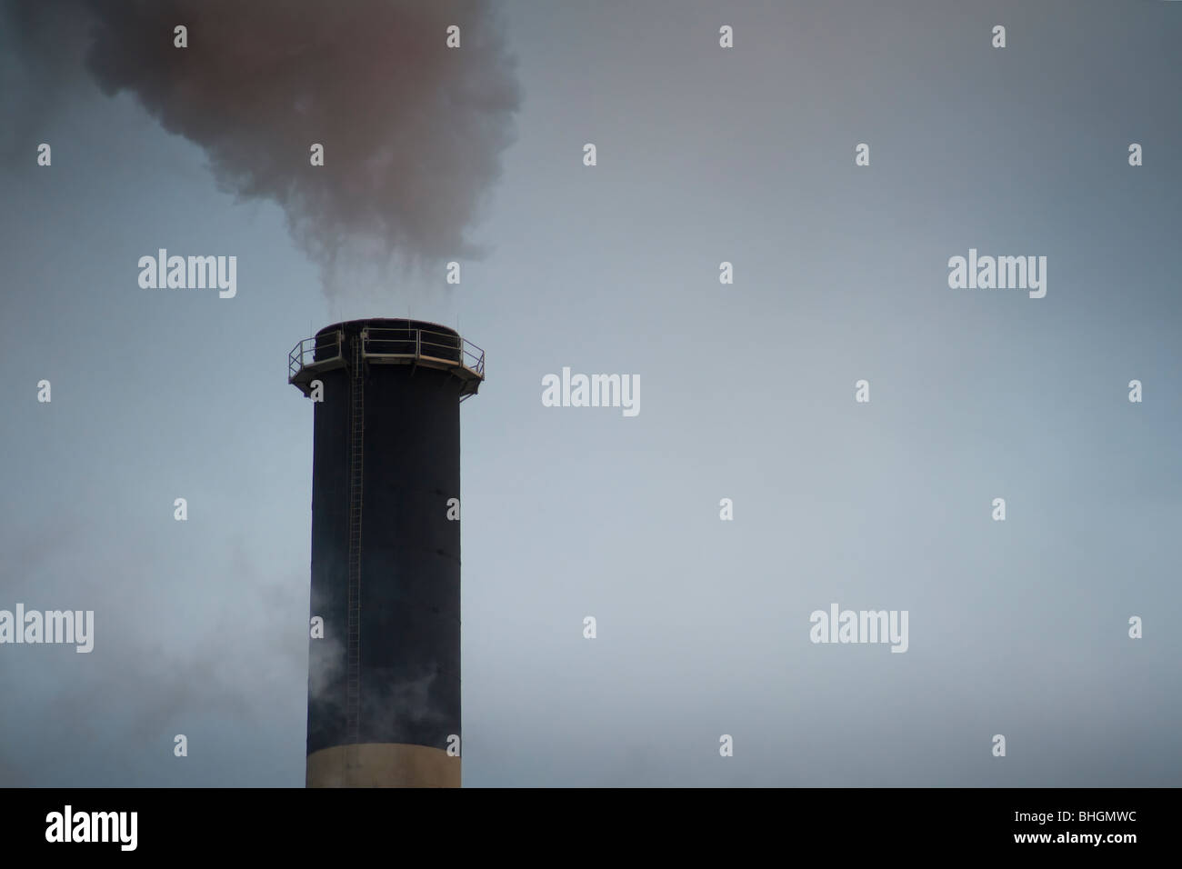 Industrial smoke stack pouring pollution into the air Stock Photo - Alamy
