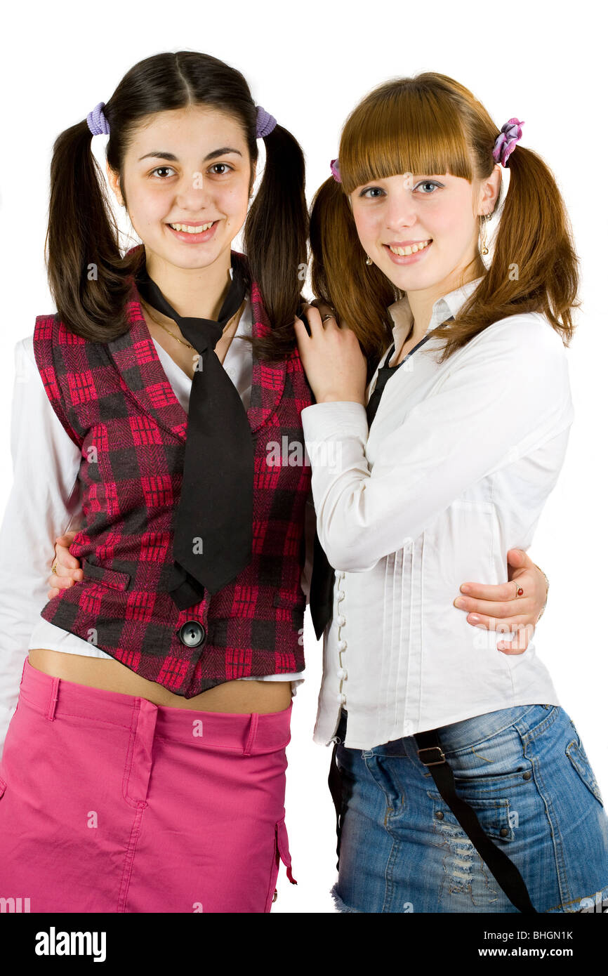 Two schoolgirls friends isolated on white background Stock Photo - Alamy