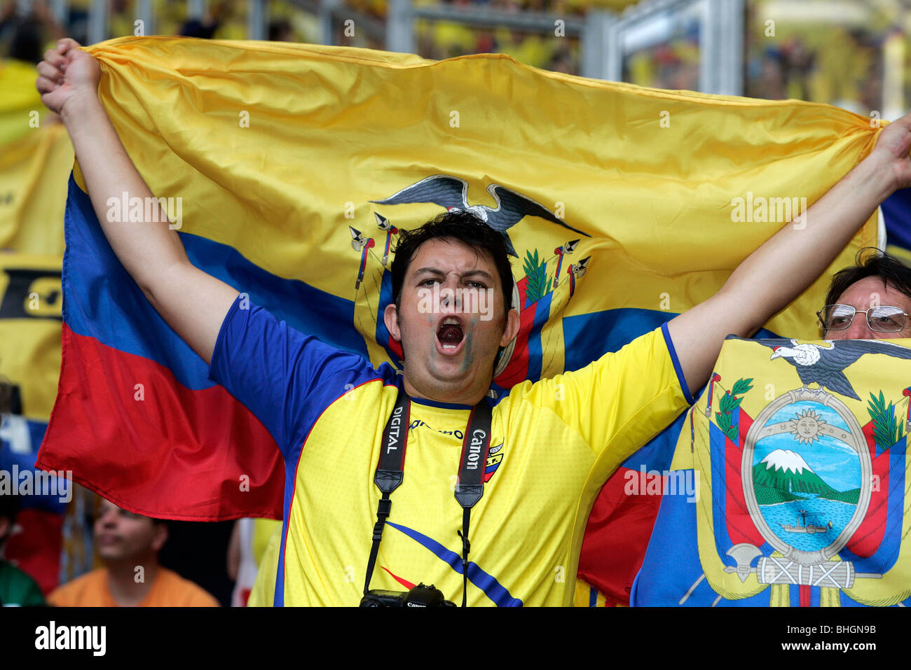 An ecuadorian fan with a flag in the stands during the 2006 World Cup ...