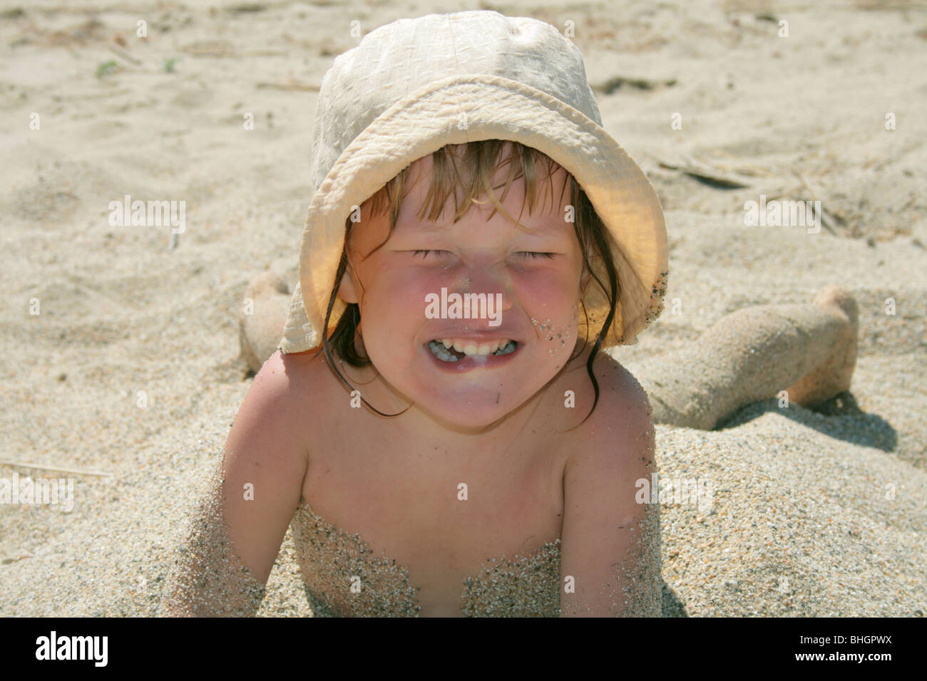 The baby girl plays with a sand Stock Photo - Alamy