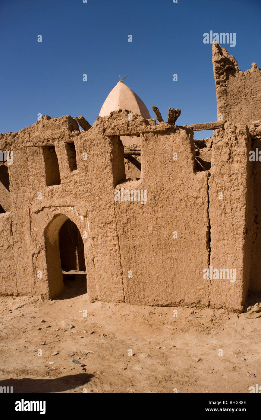 Ruined adobe house in the Draa valley in the Sahara desert near Tinfou ...