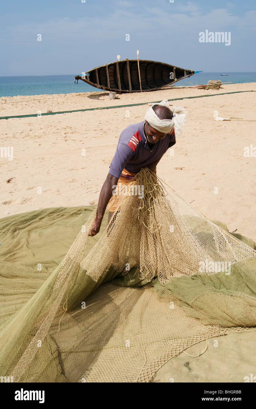 Fisherman arranging Fishing Net Stock Photo - Alamy