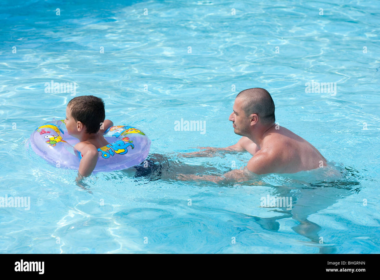 Father teaching son swimming suit hi-res stock photography and images ...