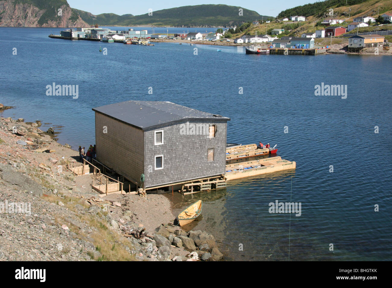 Men of Harbour Breton, Newfoundland prepare to float a building across ...