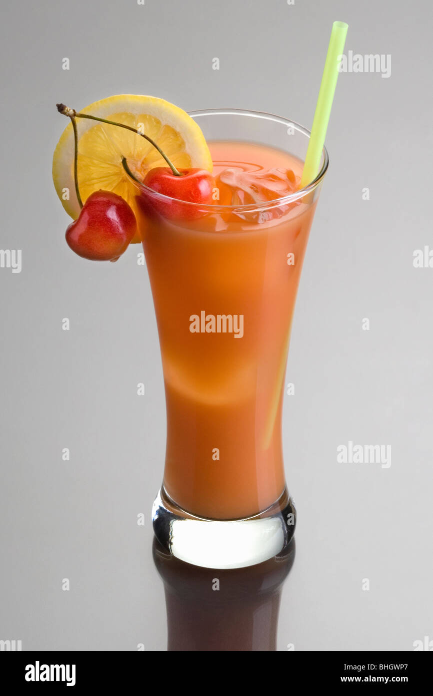 Zombie mixed drink silhouetted on plain background with reflection ...