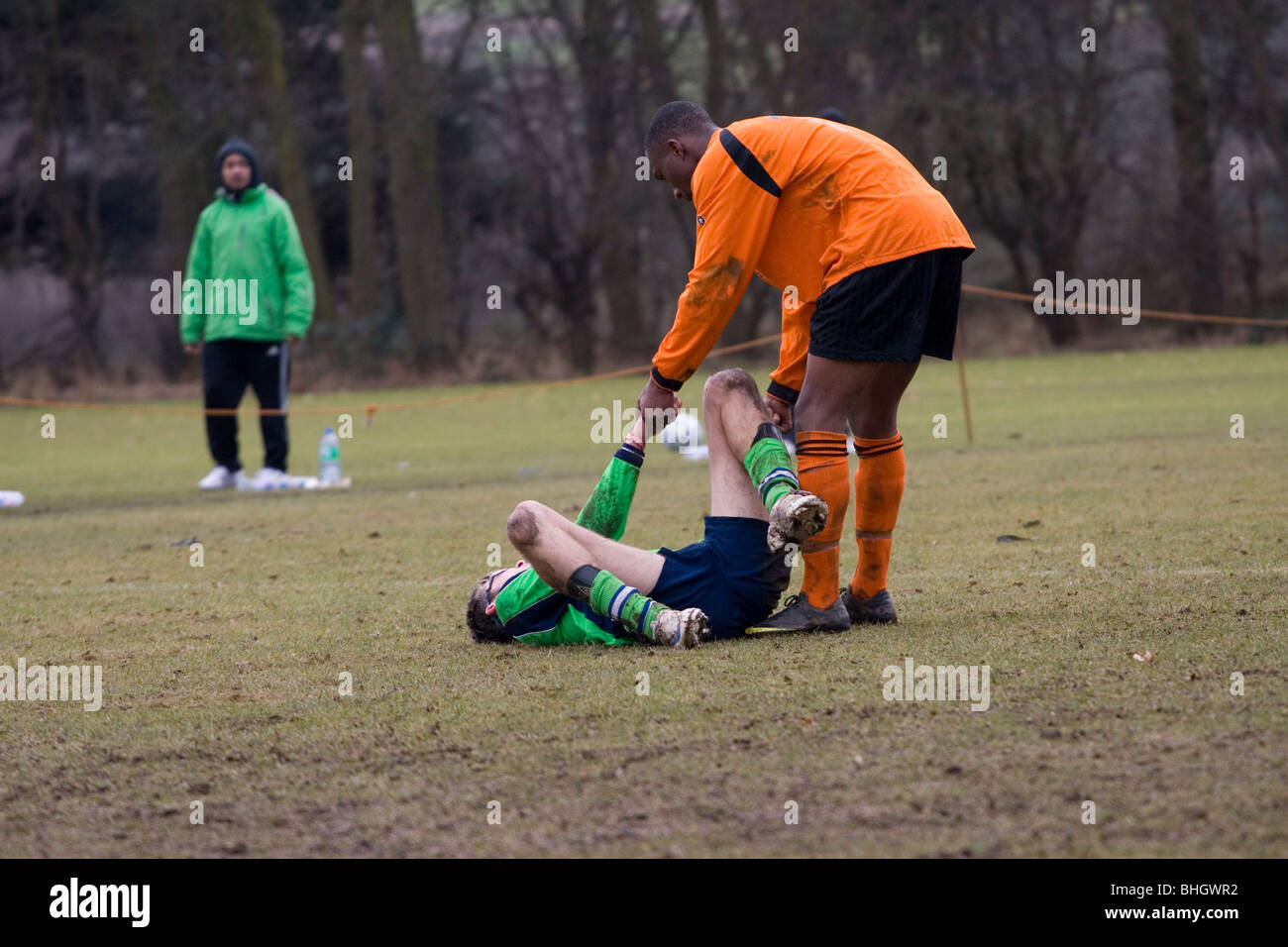 Soccer player helping opponent hi-res stock photography and images - Alamy