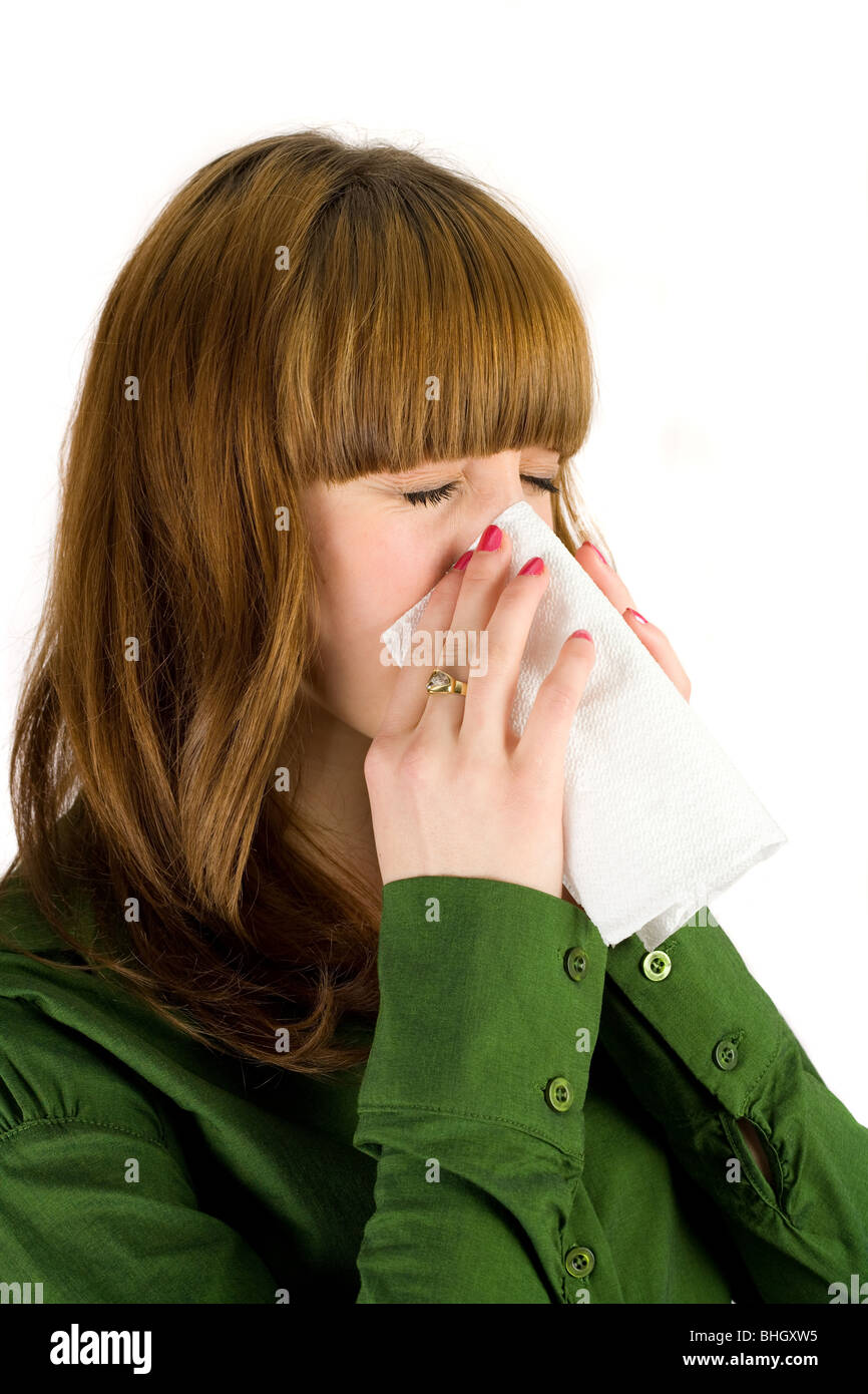 Blonde girl blowing nose, isolated on white background Stock Photo - Alamy