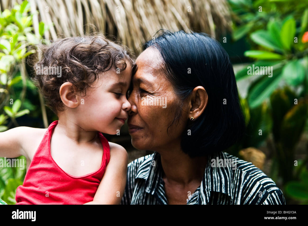 A cute European girl kisses her nanny Stock Photo - Alamy