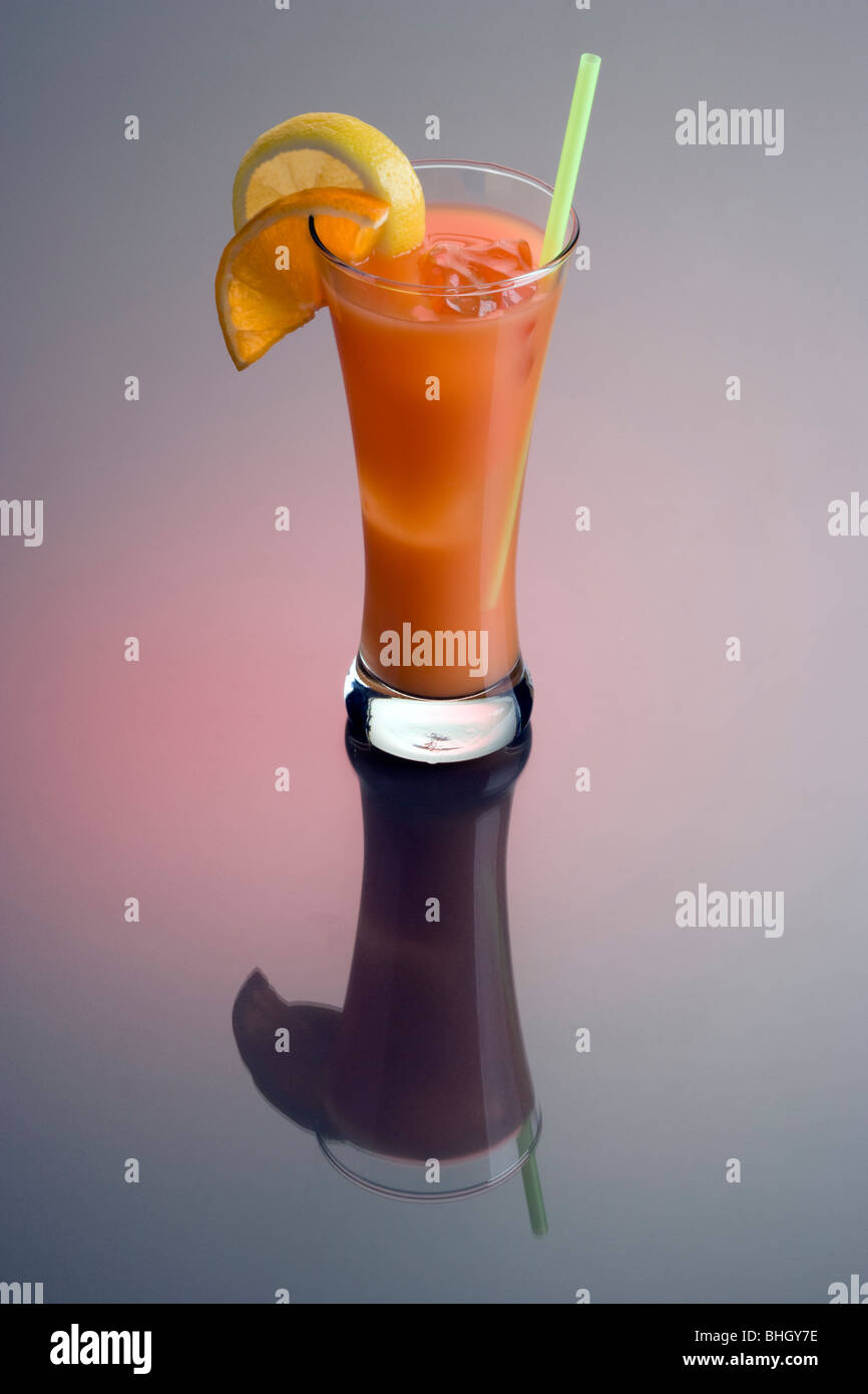 Zombie mixed drink silhouetted on plain background with reflection ...