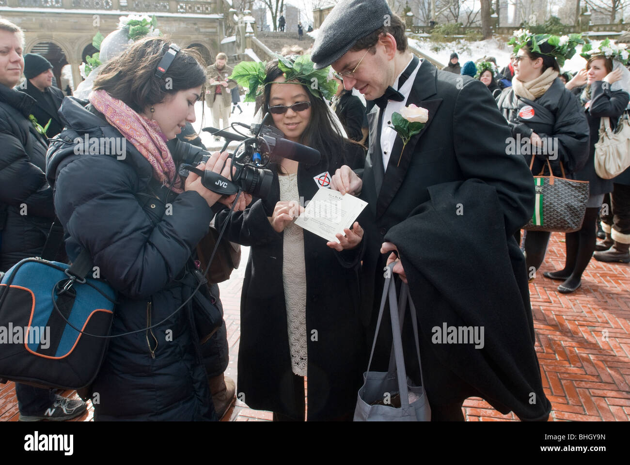 A camera person records a marriage certificate at a protest for gay ...