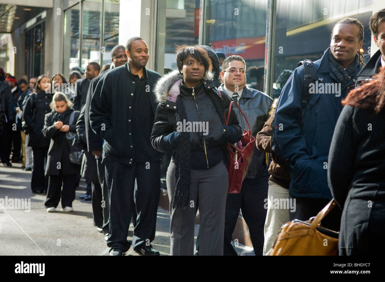 Job seekers line up for a job fair in midtown in New York on Tuesday ...