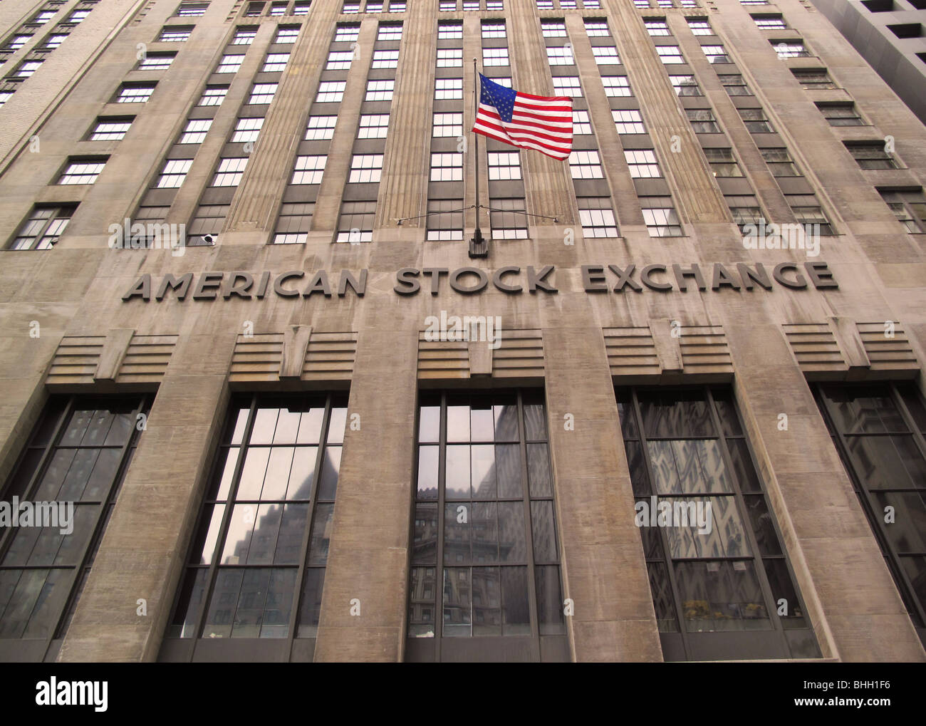 New York Stock Exchange with American flag Stock Photo - Alamy