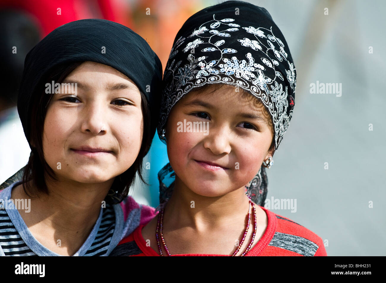 Cute Uighur girls together Stock Photo - Alamy