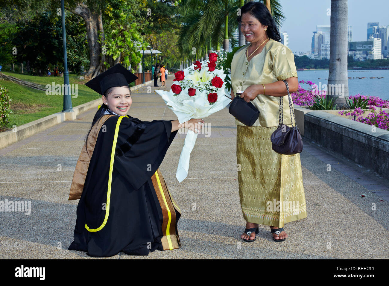 Asian Graduate. University graduation student acknowledges mothers ...