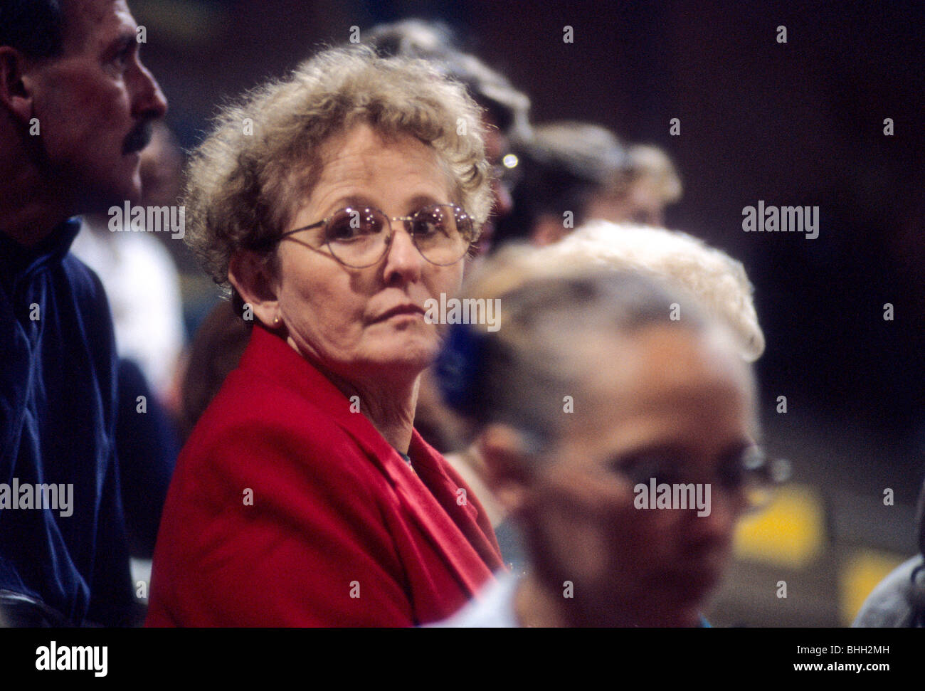 woman alert serious listen attention glass group crowd church Stock ...