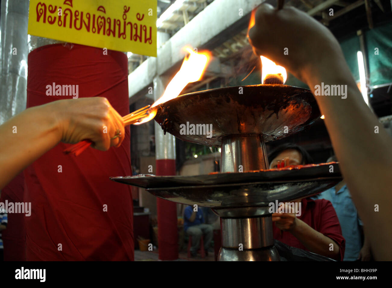 People using lamp oil , Bangkok's Chinatown, Thailand Stock Photo - Alamy