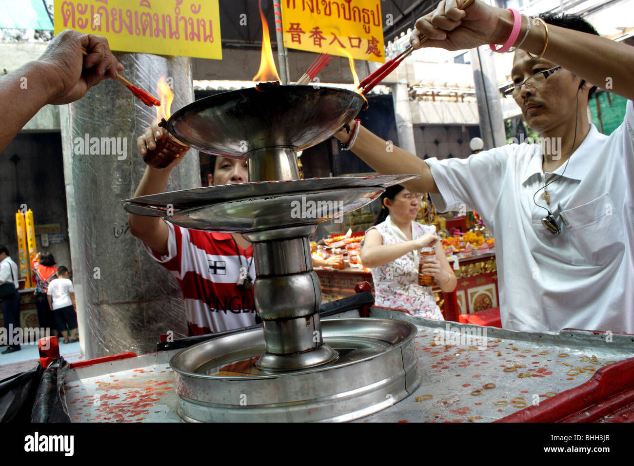 People using lamp oil in Chinese Temple , Bangkok's Chinatown , Chinese ...