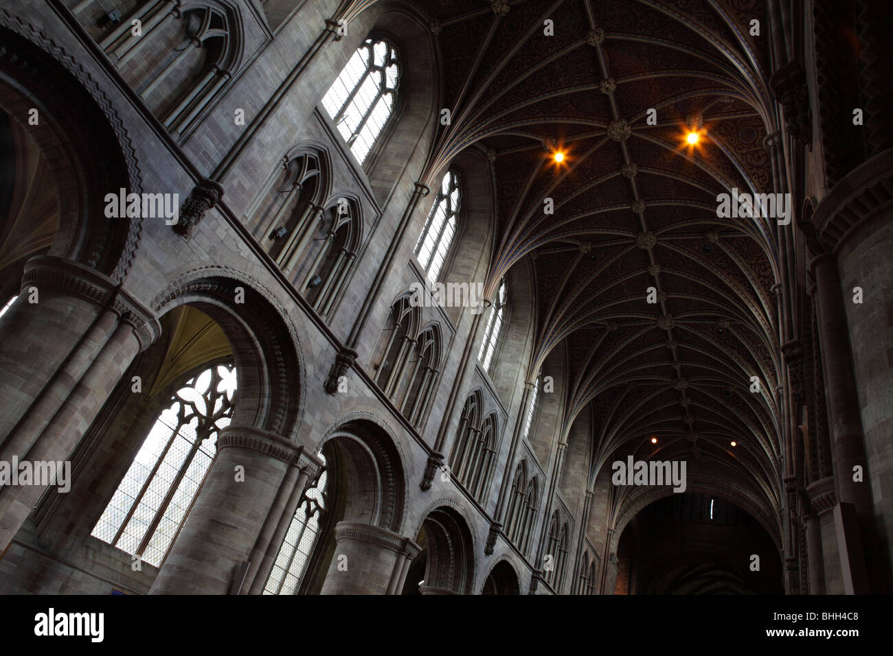 The vaulted ceiling above the Nave of Hereford Cathedral and the robust ...