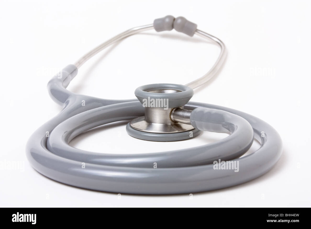 Doctors stethoscope against white Cut Out Stock Images & Pictures - Alamy