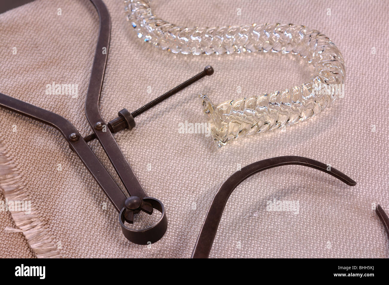 twisted glass crystal braids on a heat proof mat with calipers Stock ...