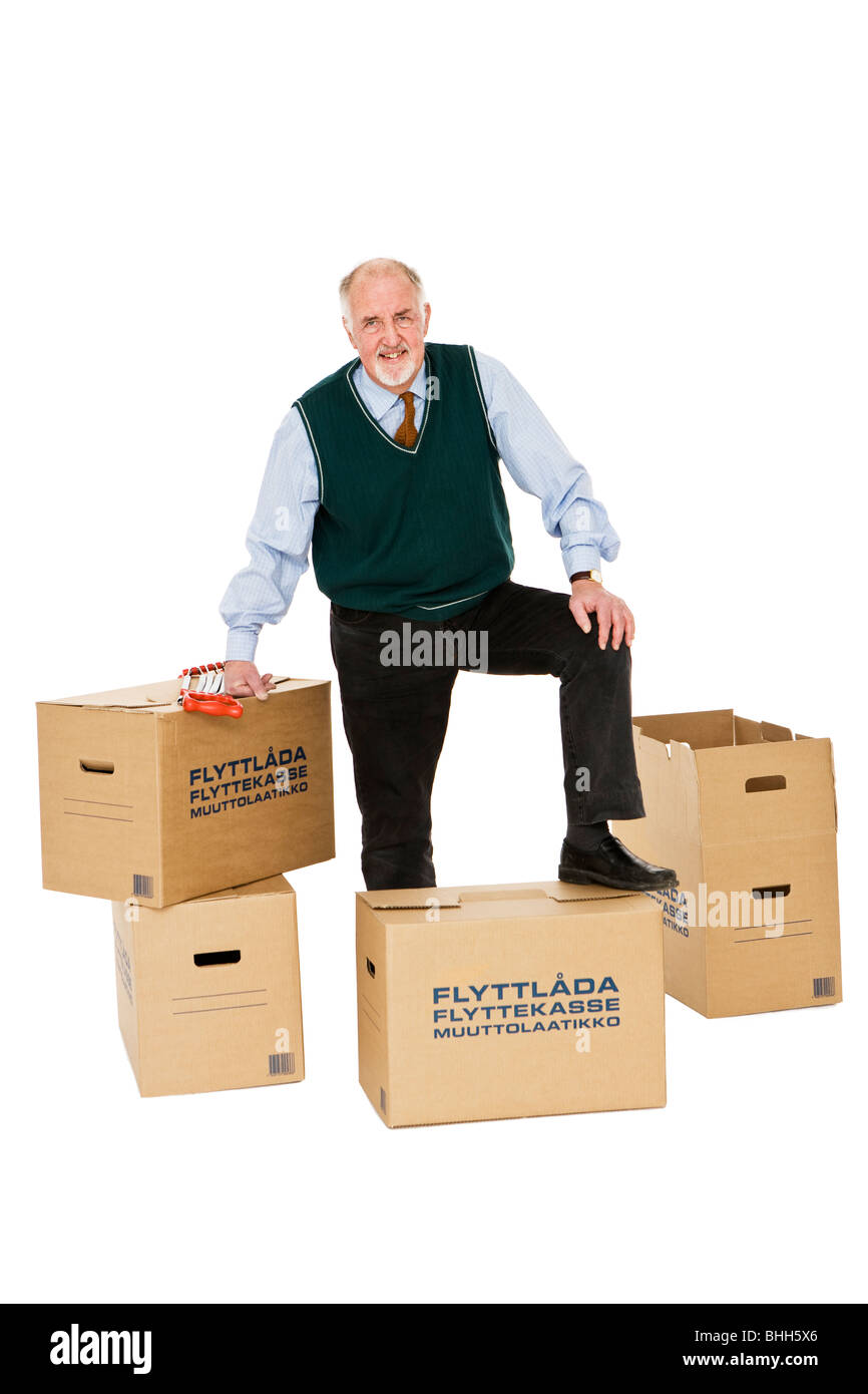 Senior man carrying boxes Stock Photo - Alamy