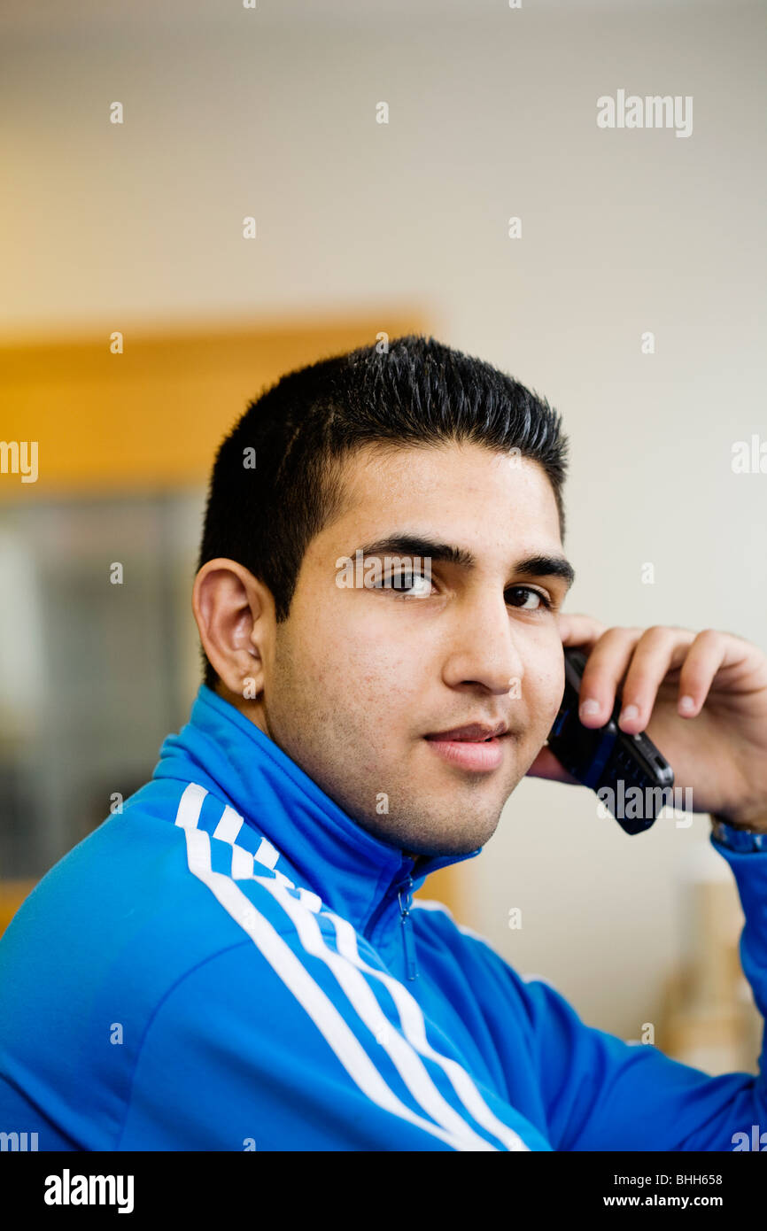 Teenage boy using a mobile phone, Sweden Stock Photo - Alamy