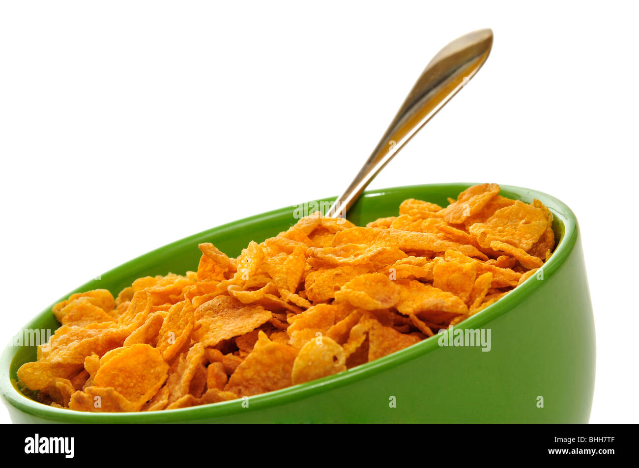 Cornflakes in the green bowl isolated on the white background Stock ...
