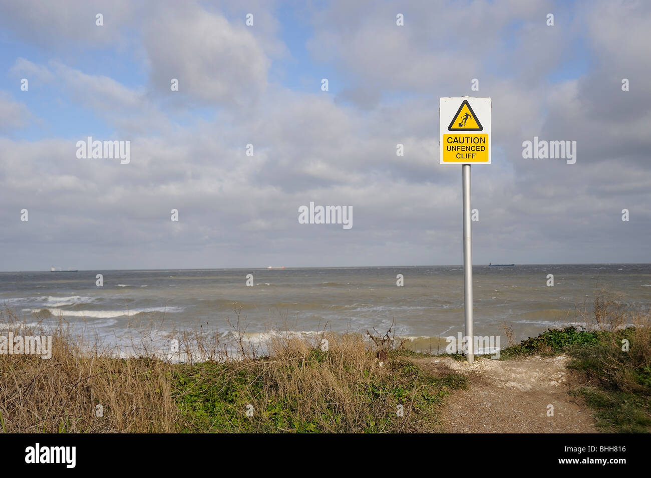Caution Unfenced Cliff Sign joss bay Kent England Stock Photo - Alamy
