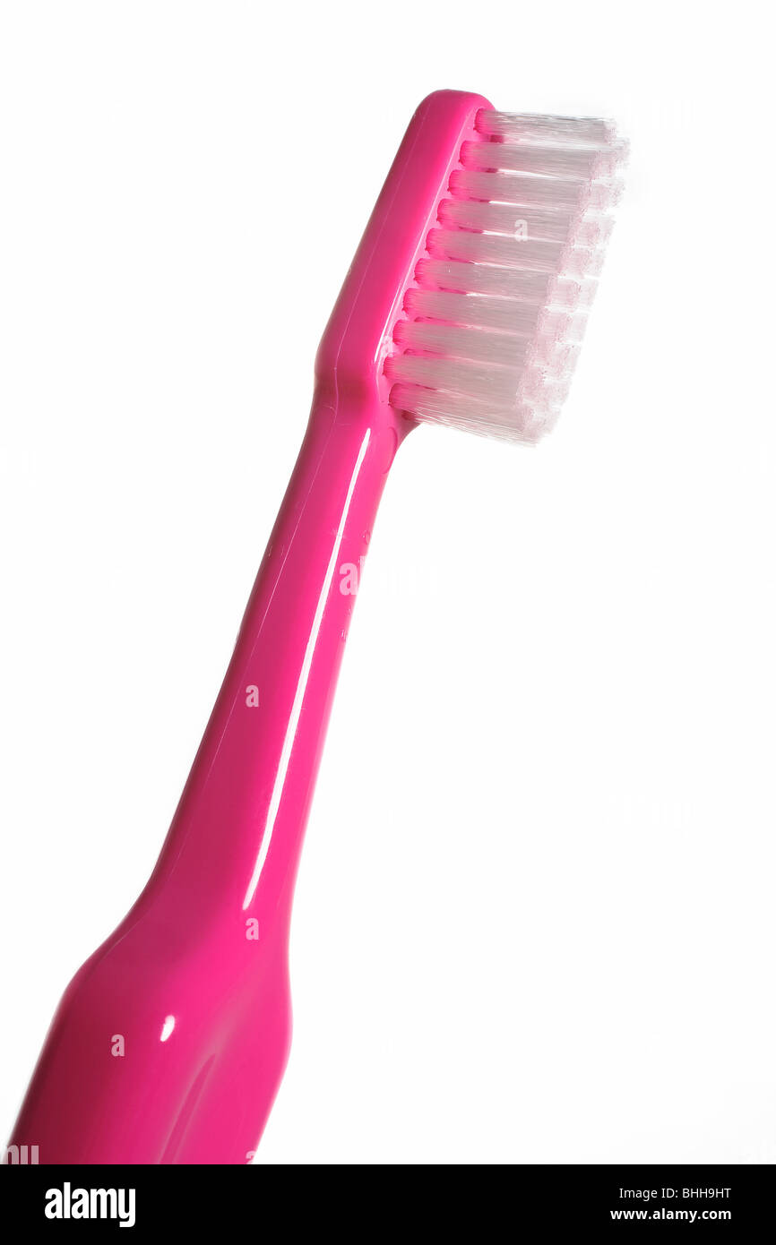 Pink toothbrush, close-up Stock Photo - Alamy