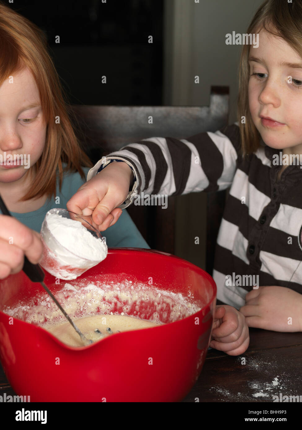 Two girls baking, Sweden Stock Photo - Alamy