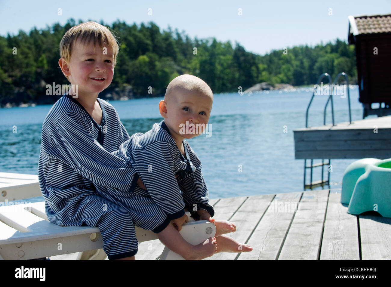 Brother and sister on a jetty, Stockholm archipelago, Sweden Stock ...